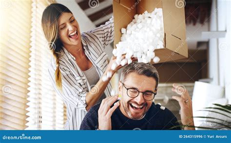 Theyre Just Being Silly A Mature Couple Having Fun With Foam Packaging