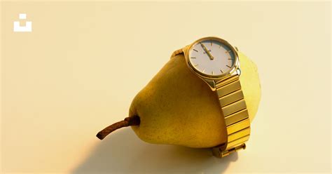 A Pear With A Watch On Top Of It Photo Free Experimental Image On