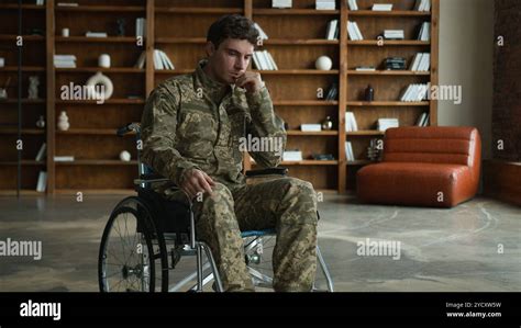 Pensive Stressed Sad Caucasian Male Officer In Camouflage Uniform Man With Disability Military