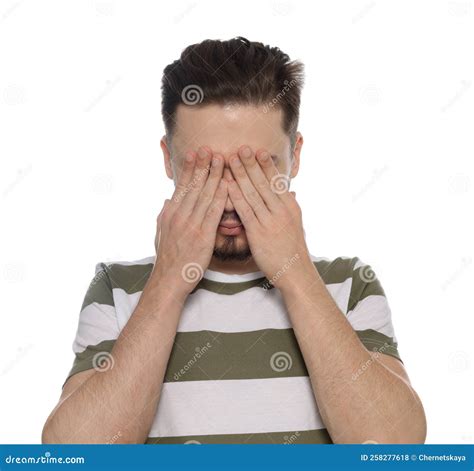 Embarrassed Man Covering Eyes With Hands On White Background Stock