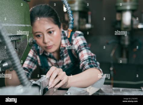 Professional Milling Machining Female Employee Put Steel Parts Into Automatic Machine And