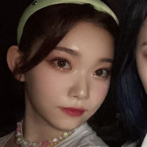 Two Women Are Posing For The Camera With Their Heads Turned To Look Like They Are Wearing Pearls