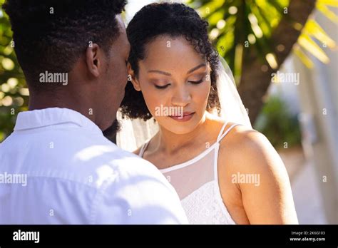 Happy African American Couple Getting Married Embracing During Wedding