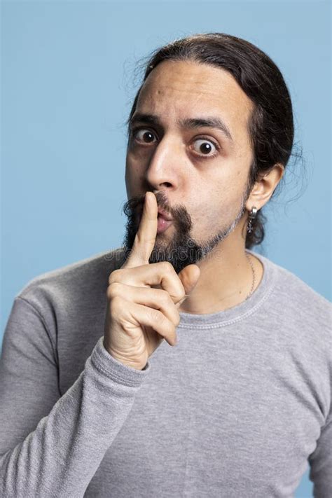 Secretive Adult Showing Mute Silence Symbol In Front Of The Camera