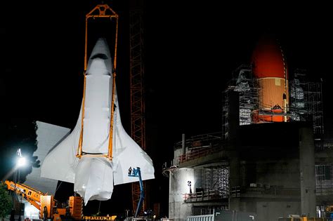 Space Shuttle Endeavour Hoisted For Display In Launch Configuration At