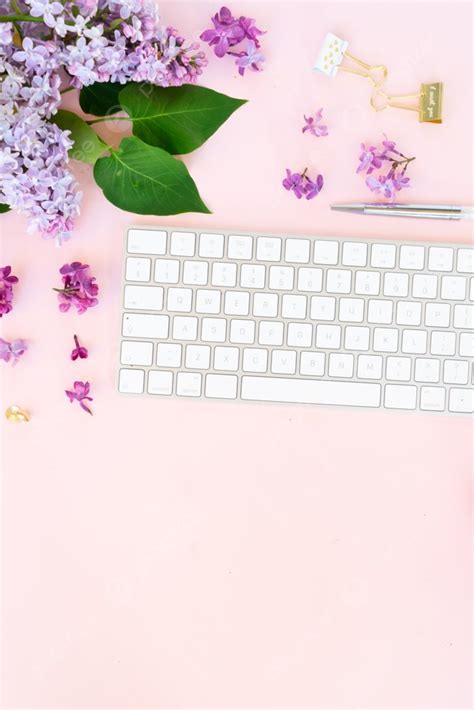 Flat Lay Top View Home Office Workspace Modern Keyboard With Lilac Flowers And Copy Space On