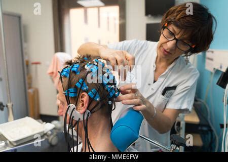 Man Undergoing An Electroencephalogram EEG Epilepsy Screening Angouleme Hospital France