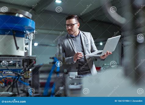 Manager Industrial Engineer Using Laptop Check And Control Automation