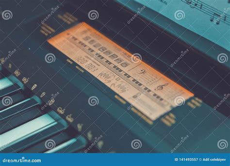 The Part Of Professional Midi Keyboard With Blue Screen On Black