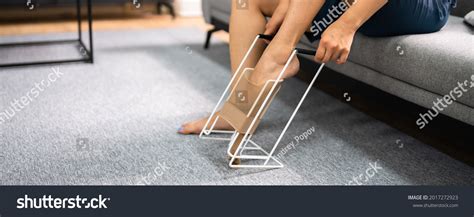 Woman Putting On Medical Compression Stockings Stock Photo Shutterstock