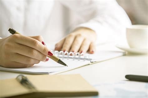 Premium Photo Female Writing In Notepad