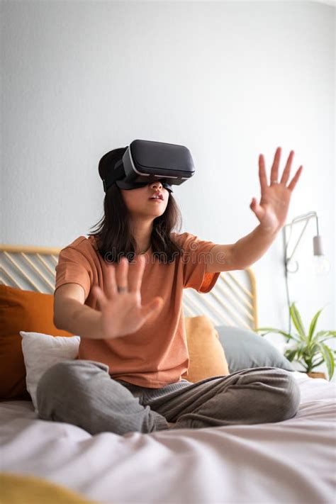 Vertical Portrait Of Teen Asian Girl Moving Hands Touching Objects In