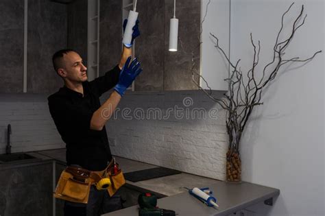 Electrician Mounting Ceiling Lamp Installing The Wires Stock Image Image Of Installing