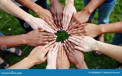 Diverse Group Of People Standing In Circle With Hands Together In Teamwork Community Support