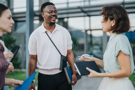 Business Professionals Engaging In Conversation In Urban Setting Stock Image Image Of