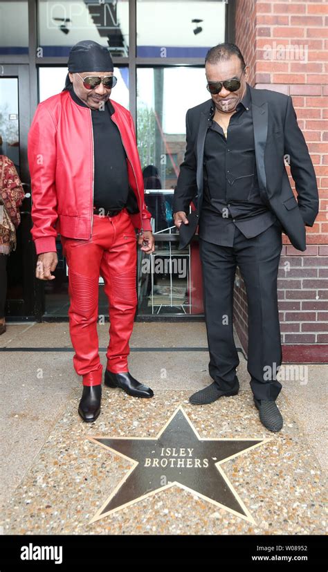 The Isley Brothers Ernie Isley L And Ronald Isley Look At Their New Star During Their