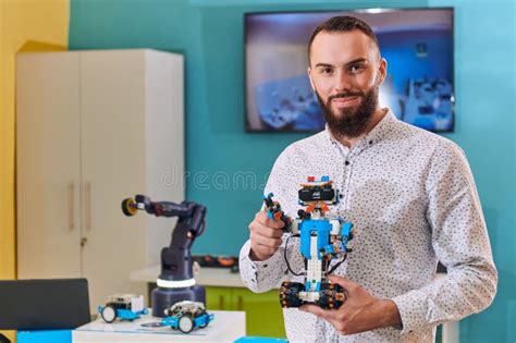 A Man Working In A Robotics Laboratory Focusing On The Intricate Fields Of Robotics And 3d