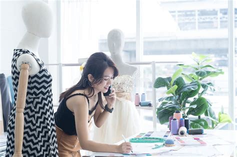 Designer Talking On The Mobile Phone Accepting Work From A Customer Fashion Designer Woman