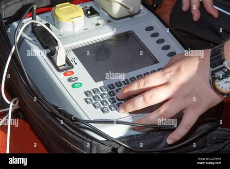 Electrician Using Pat Portable Appliance Testingtesting Machine Electrician Using Pat Portable Appliance Testingtesting Machine