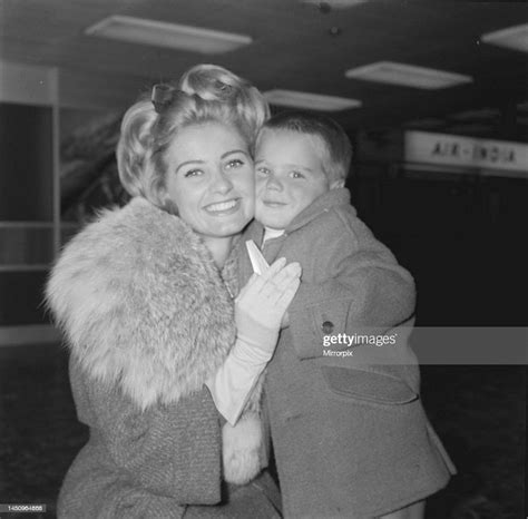 Jill Ireland Poses With Her Young Son Paul After Arriving At London