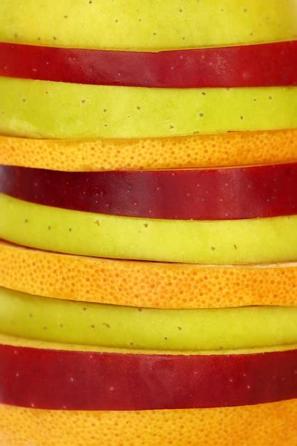Premium Photo Close Up Of Mixed Slices Of Fruit In A Row