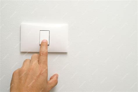 Premium Photo Turn Onoff The Light Switch To Save Electricity