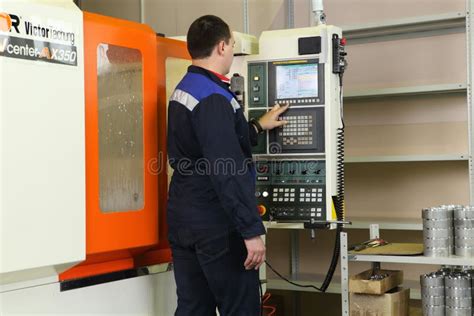 Operator Uses Control Display For Managing Lathe Cnc Machine Editorial Photography Image Of