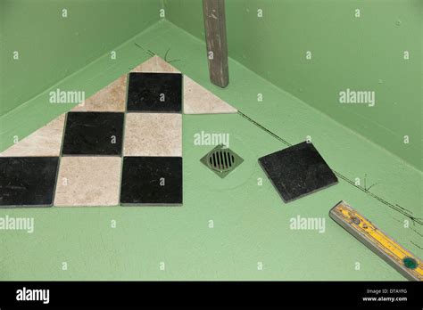 Installing Floor Tiles Stock Photo Alamy