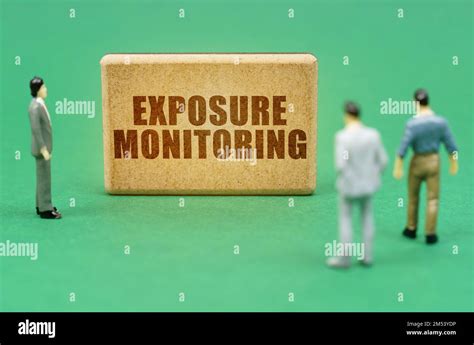 Security And Insurance Concept On The Green Surface Are Figures Of People And A Sign With The