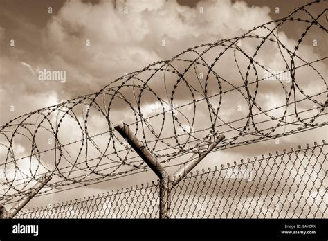 Security Barrier With A Barbed Wire Fence Stock Photo Alamy