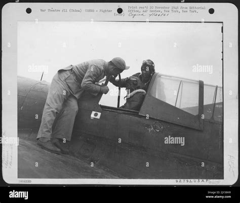 Colonel Eugene L Strickland Makes His Final Check With Pilot Lt T Y Cheng Seated In The