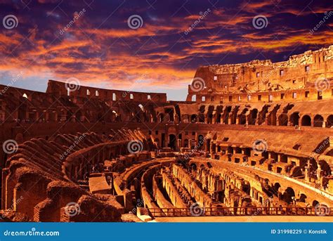 Bright Crimson Sunset Over The Ancient Colosseum During A Sunset Rome