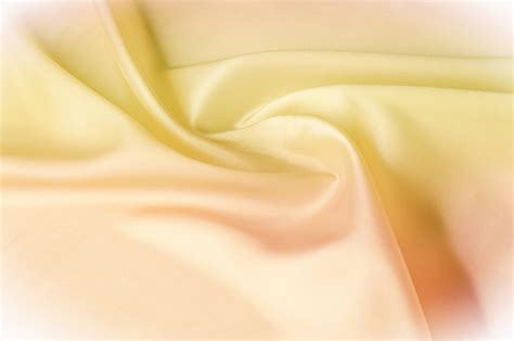 직물의 질감 배경입니다 베이지색 직물입니다 세피아 파스텔 노란색 크림 베이 지 색조에 실크 직물 벽지 질감 배경 패턴 사랑 스러운 천연 실크 질감된 섬유 0명에 대한 스톡