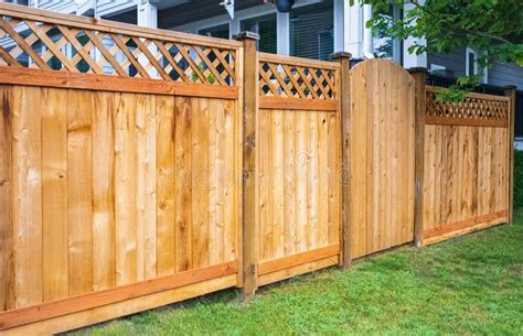 Nice Wooden Fence Around House Wooden Fence With Green Lawn Stock