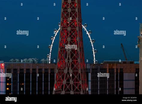 The High Roller At Dusk Seen Behind The Eiffel Tower Of Paris Las Vegas