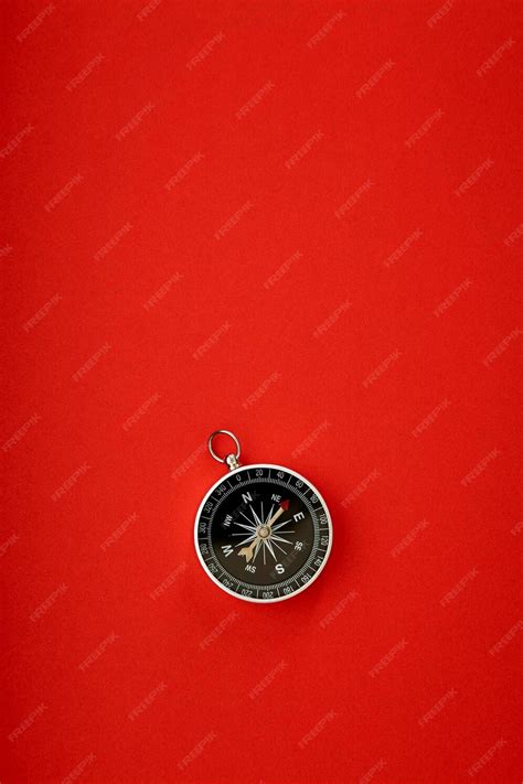 Premium Photo Close Up Of Compass Against Red Background