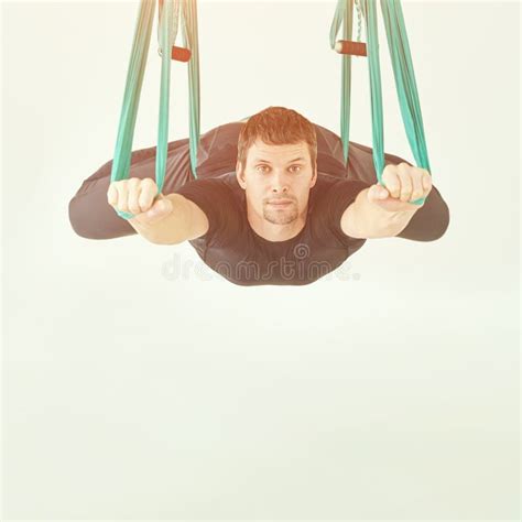 Male Person Do Hammock Yoga Class Exercise Meditation In Air Calm