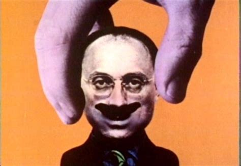 A Man With A Mustache And Moustache Holding His Hands Up To The Camera