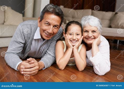 Fun On The Floor With Granny And Gramps A Girl Lying Down And Smiling