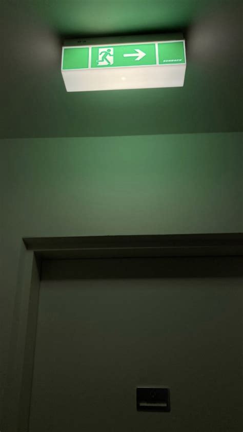 Green Exit Sign With Light Fixture