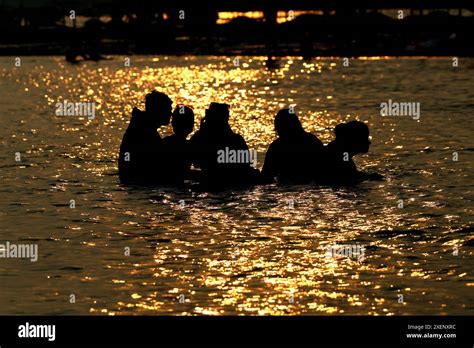 People Cool Themselves In Sangam Confluence Of Rivers Ganges Yamuna And Mythical Saraswati On