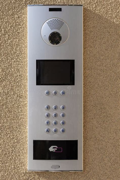Modern Intercom System With Camera Keypad And Contactless Card Reader Installed On Textured
