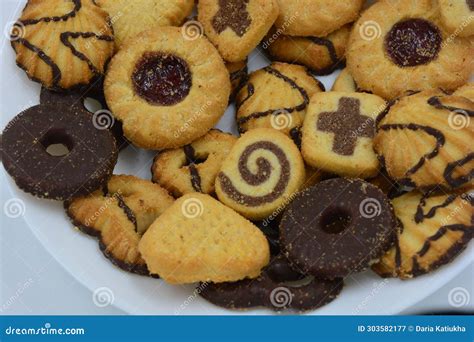 Assortment Of Shortbread Cookies Covered With Chocolate And Jam Of