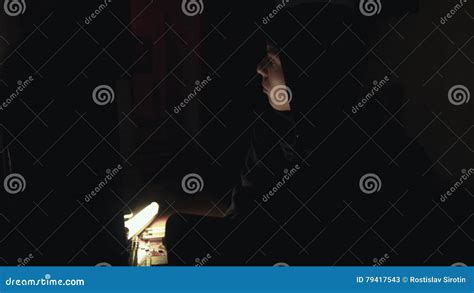 Hacker In Hood Cracking Code Using Computers In Dark Room Stock Video