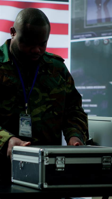 Vertical Us Military Personnel Work In A Modern Army Command Post Safeguarding Classified