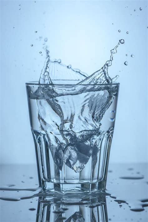 A Glass Of Clean Water Into Which An Ice Cube Was Thrown Water