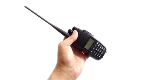 Premium Photo Close Up Of Hand Holding Walkie Talkie Over White