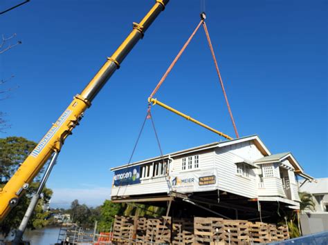 Crane Lifting A House At Christy Nathan Blog
