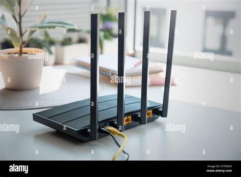 Modern Wi Fi Router On Light Table In Room High Speed Internet Concept Stock Photo Alamy