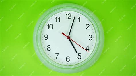 Premium Photo Close Up Of Wall Clock On Green Background